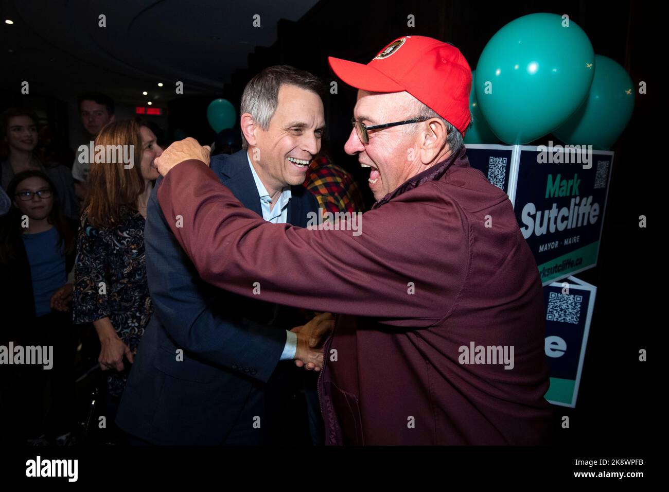 Mark Sutcliffe is embraced by a supporter as he arrives for his victory ...