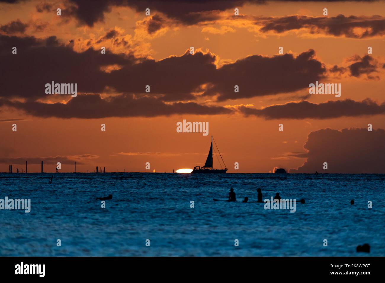 Incredible sunset on Waikiki Beach with sail boat silhouette. Sunset ...