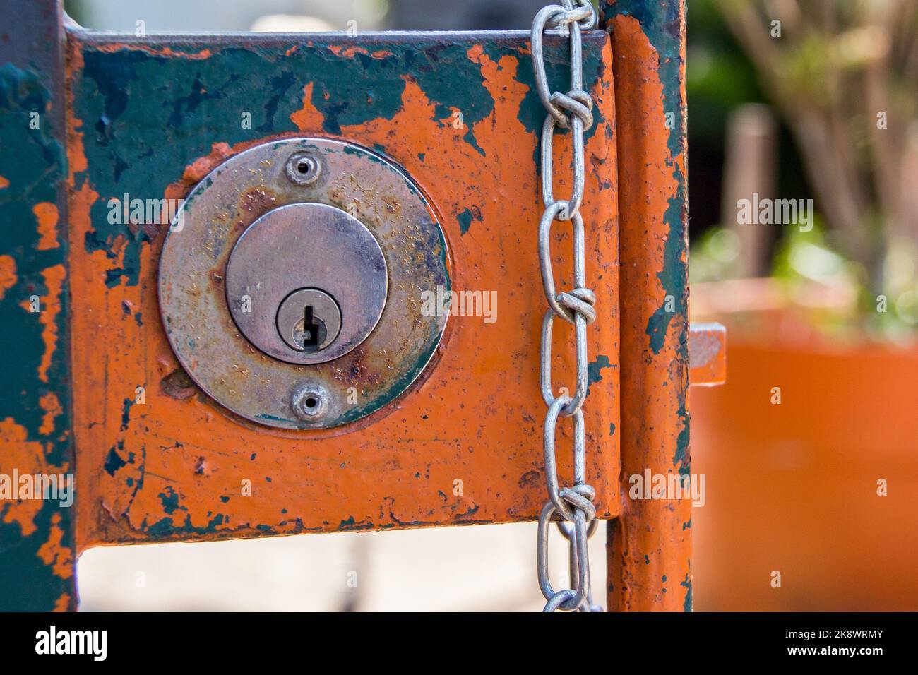 Closeup of an old lock. Old gate with a chain hanging down Stock Photo ...