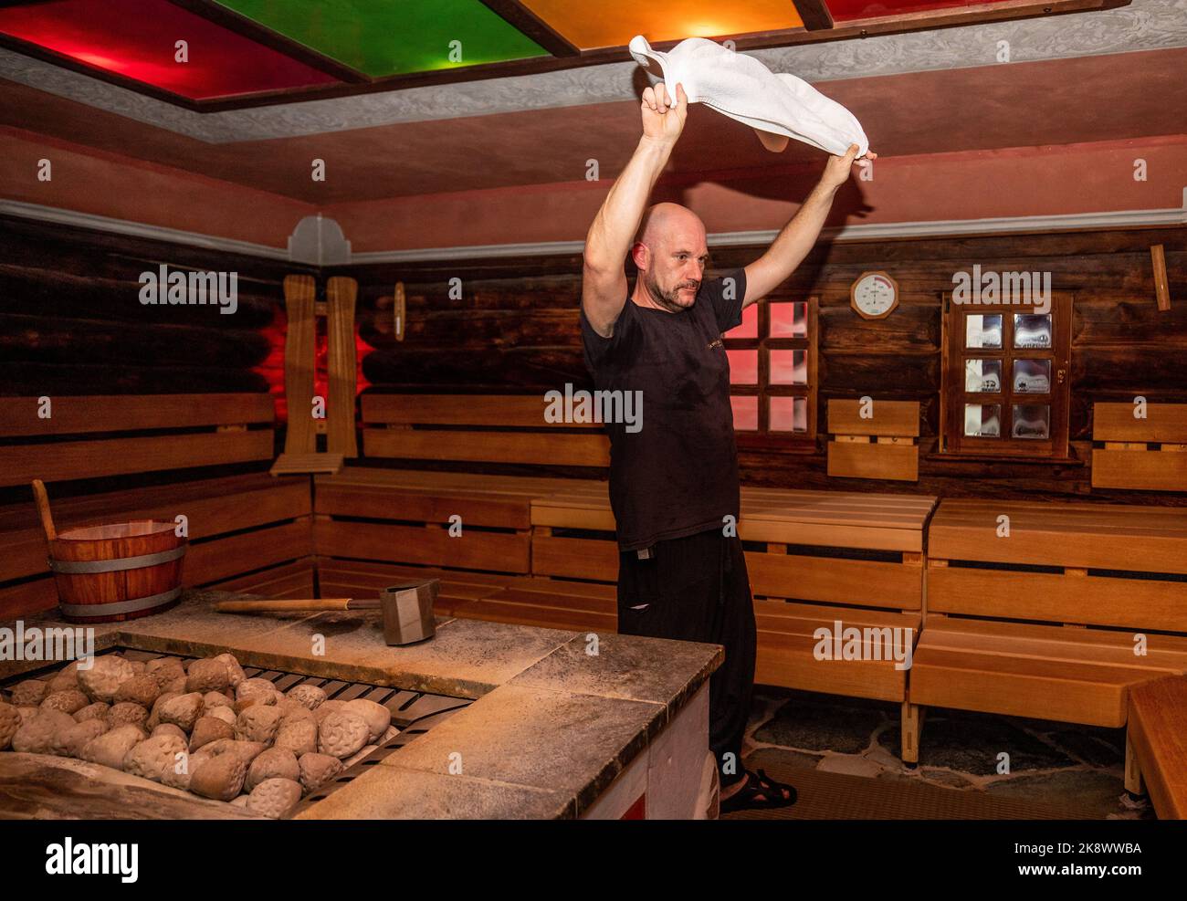 Stuttgart, Germany. 21st Oct, 2022. Sauna master Marcus Krämer swirls ...