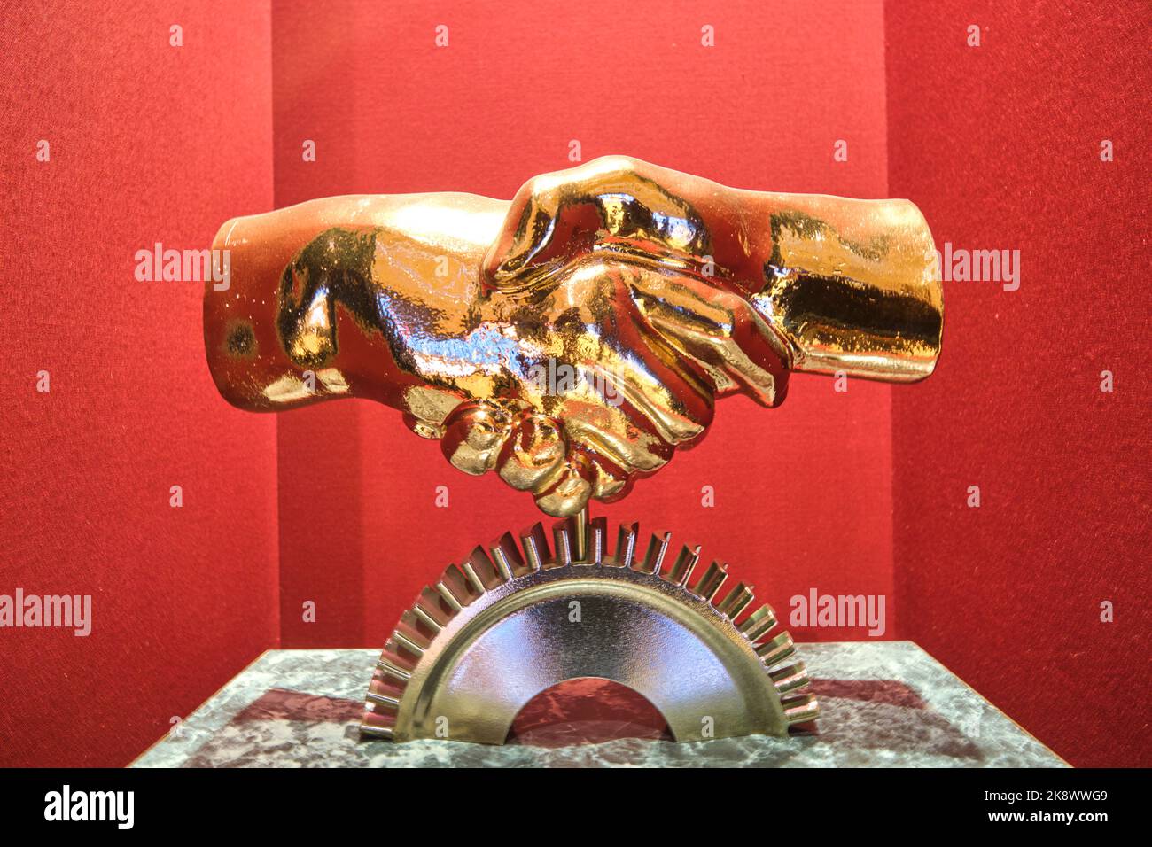 A gold sculpture of shaking hands, a gift. At the Nazarbayev Tsentr 2 ...