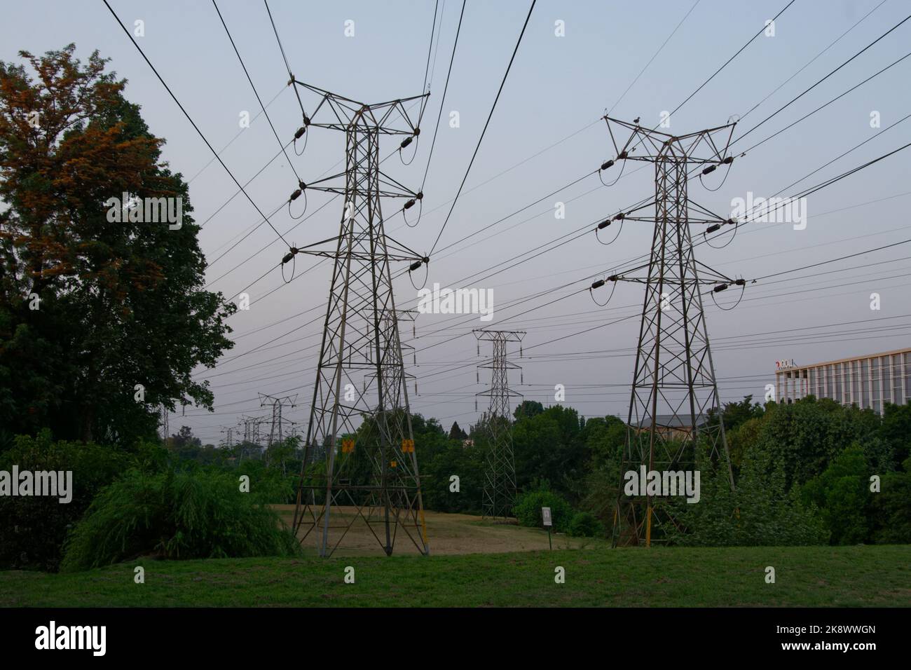 Power Pylons in an Urban setting with overhead cables directly overhead ...