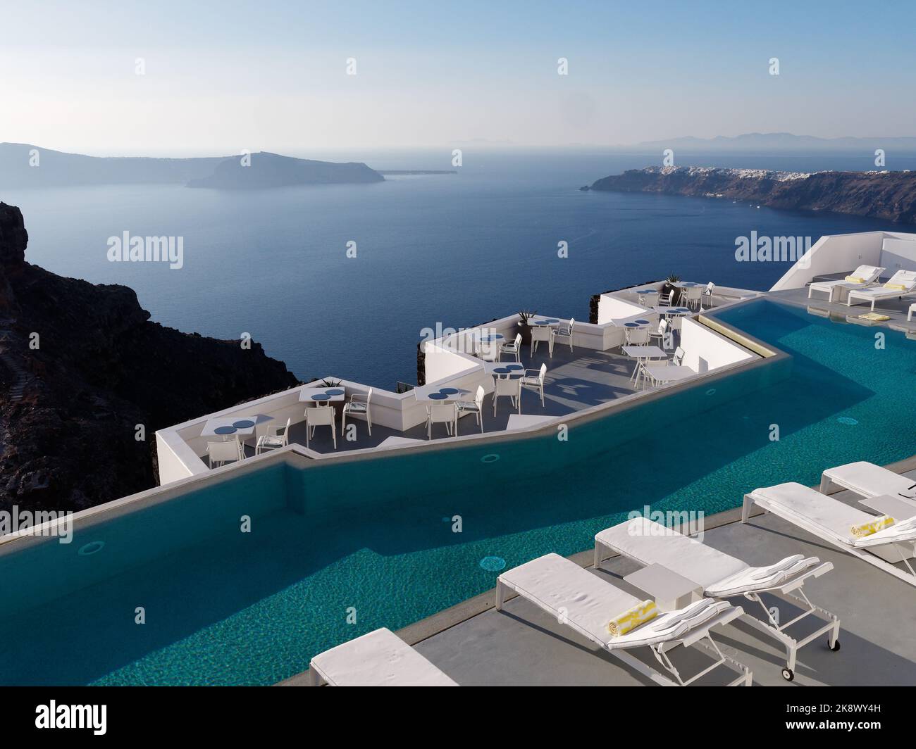 Luxury hotel swimming pool view over the Caldera. Aegean Cyclades ...