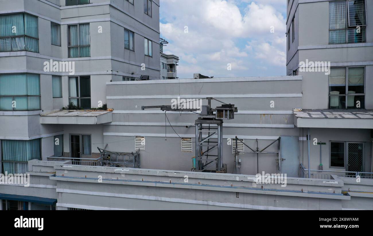 Building cranes and cradles for washing windows on the roof of the ...