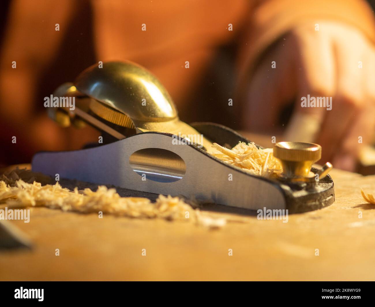 artisan using plane in his workbench Stock Photo - Alamy