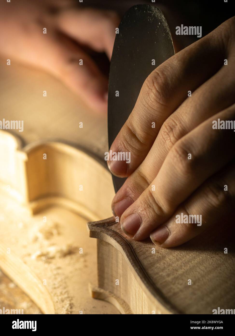 smoothing fiddle table on maker workbench Stock Photo - Alamy