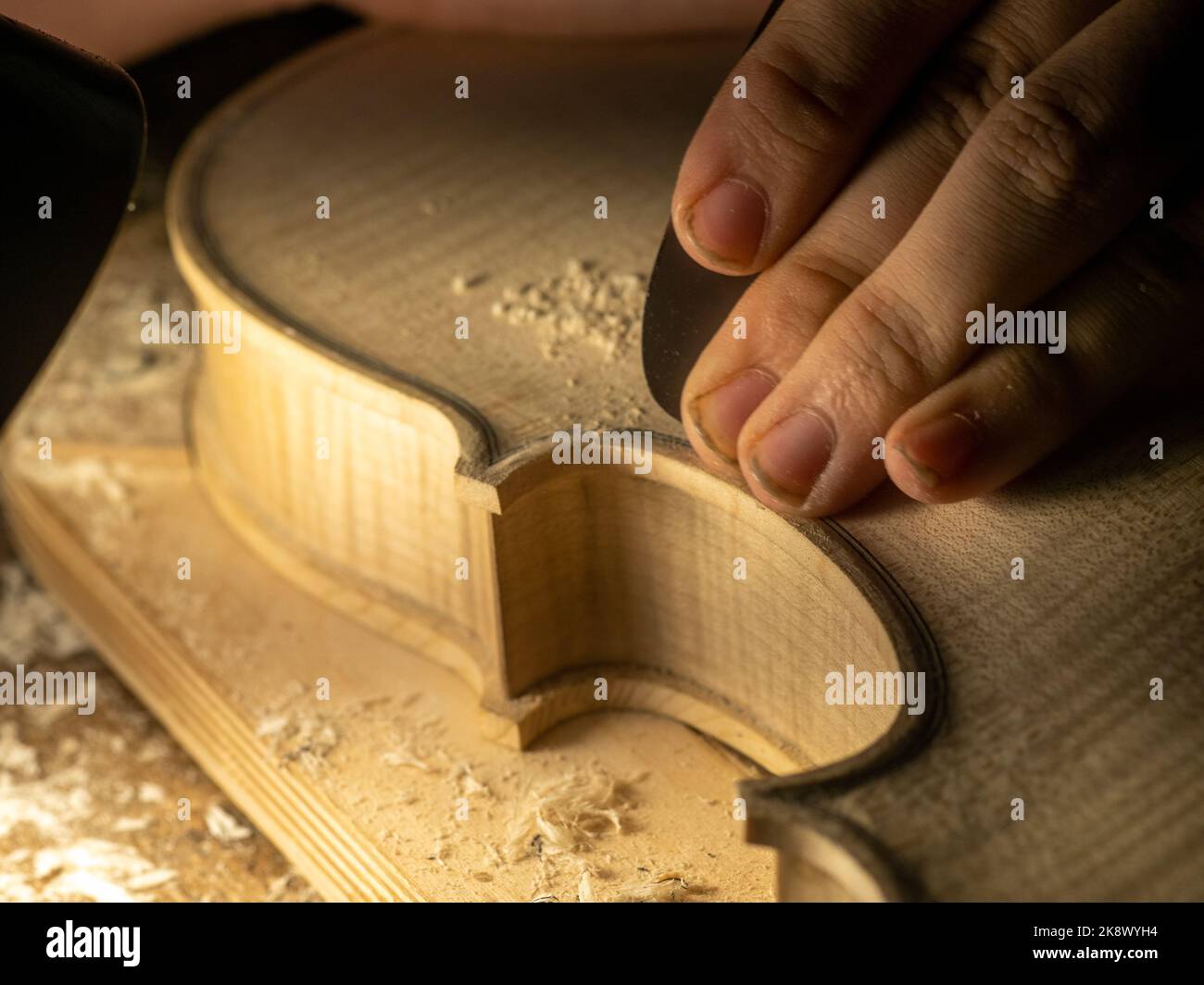 smoothing fiddle table on maker workbench Stock Photo - Alamy
