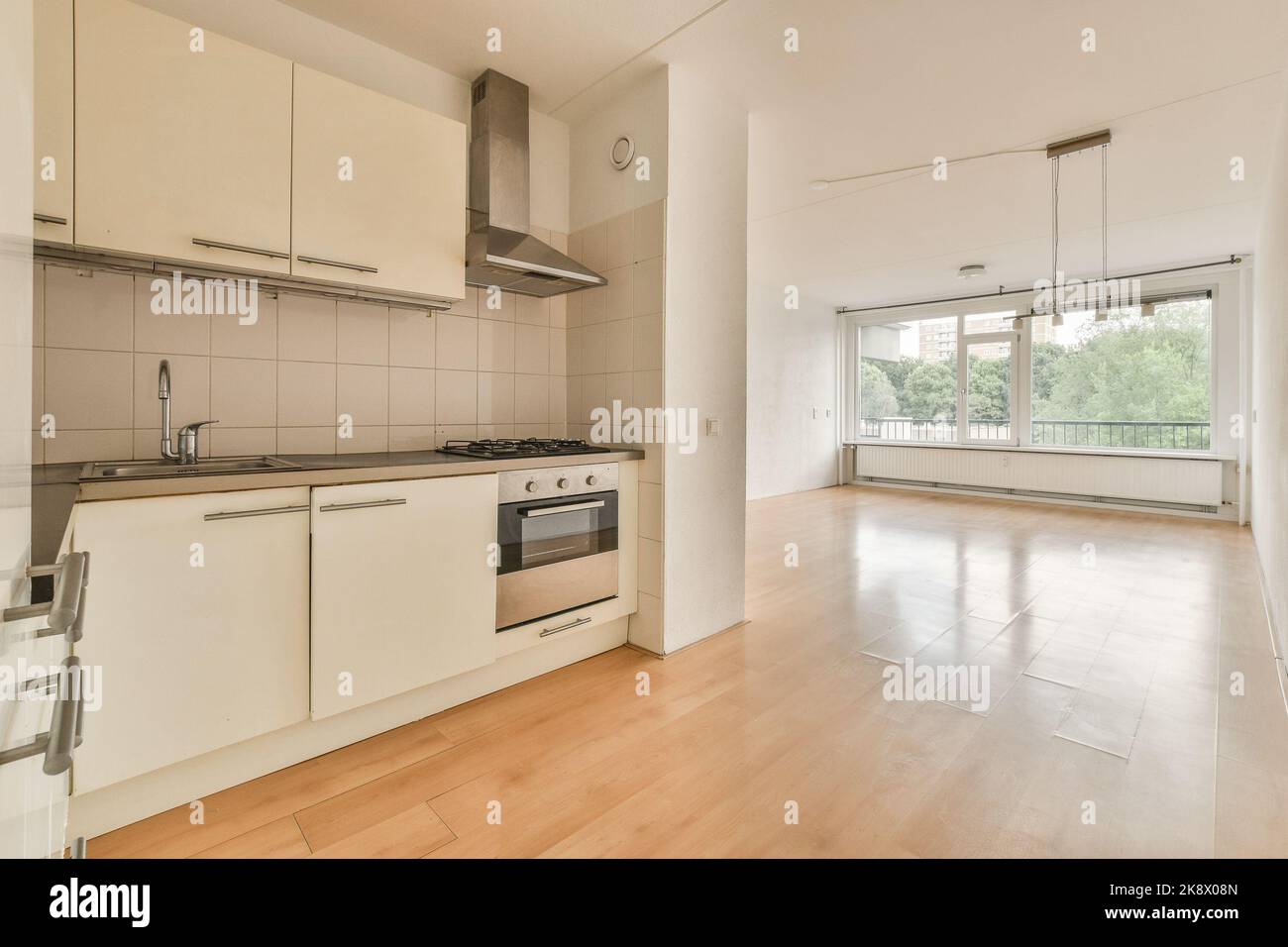 Interior design of spacious empty studio apartment with large windows ...