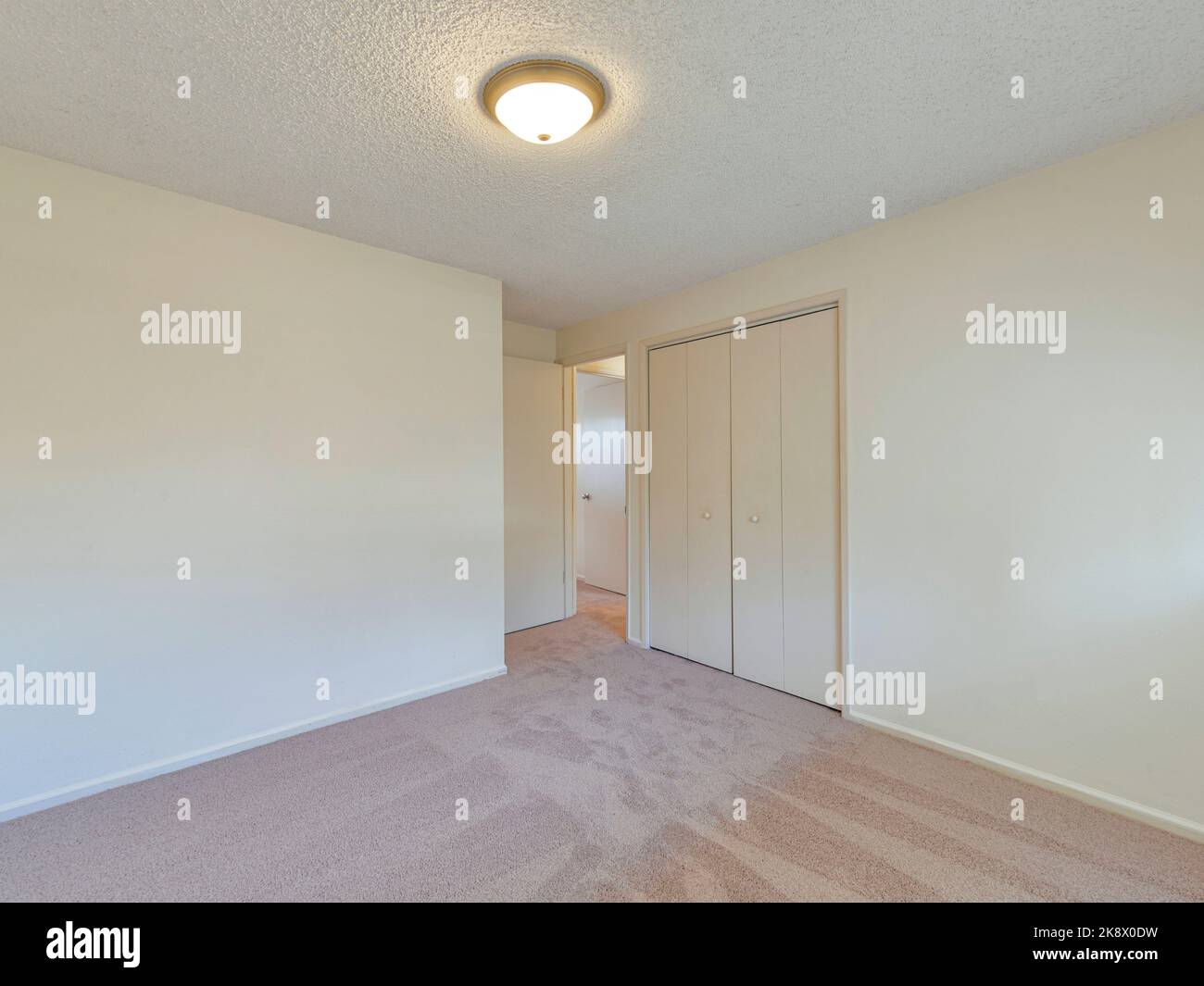 Modern residential empty bedroom interior Stock Photo - Alamy