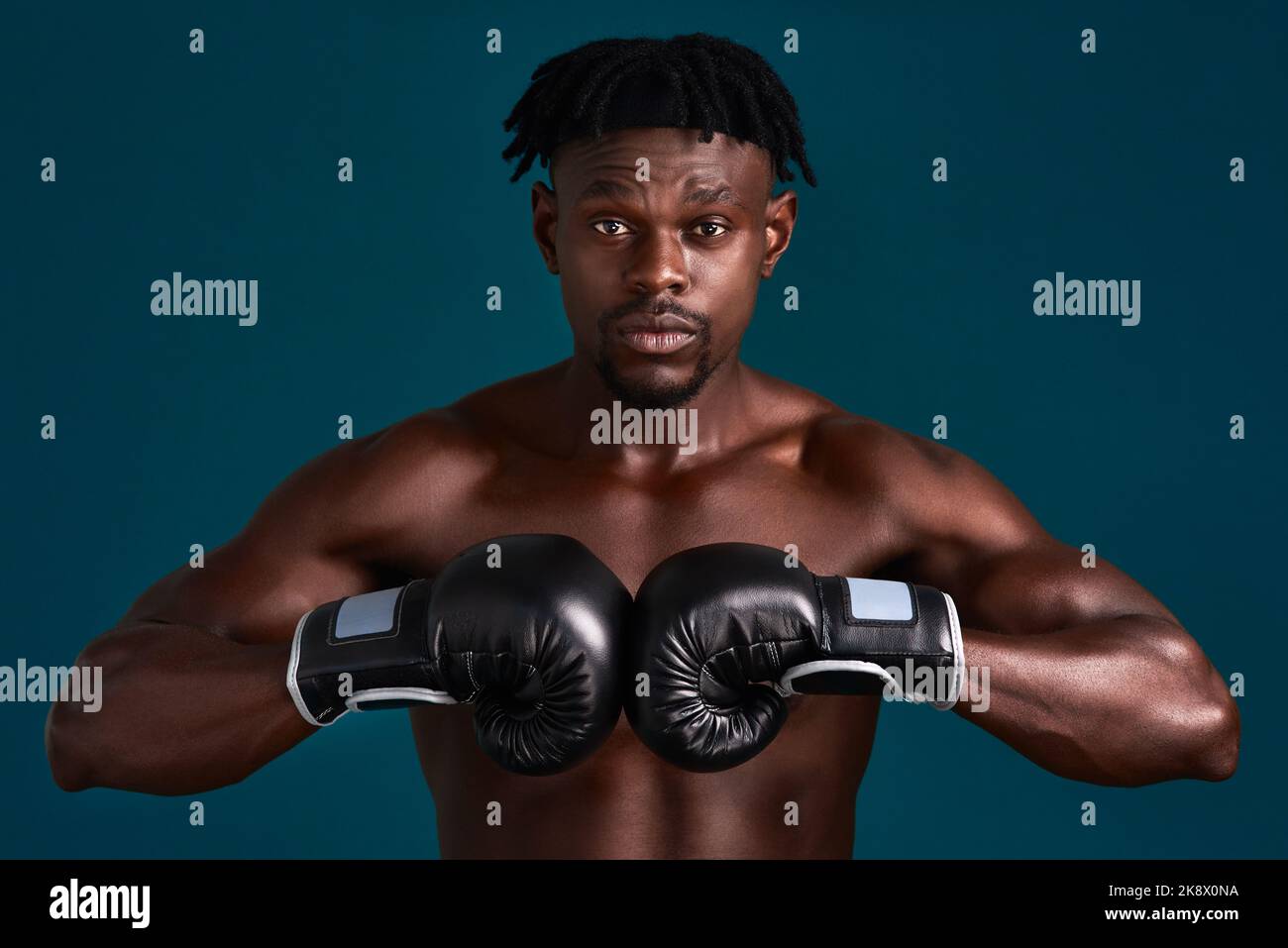 I work hard for this body. Cropped portrait of a handsome young boxer ...