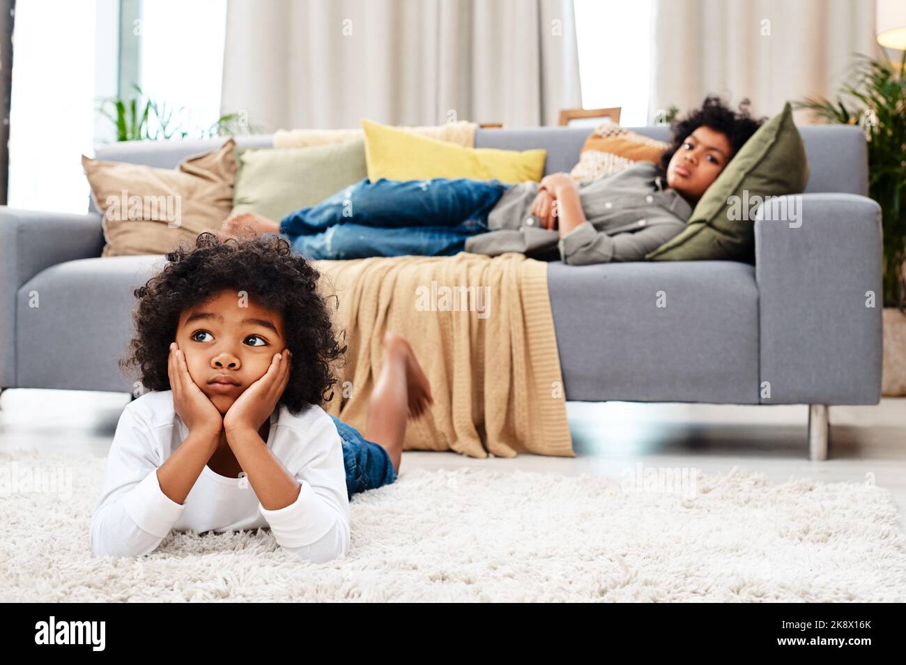 Our favorite cartoon show is about to start. two adorable little boys ...