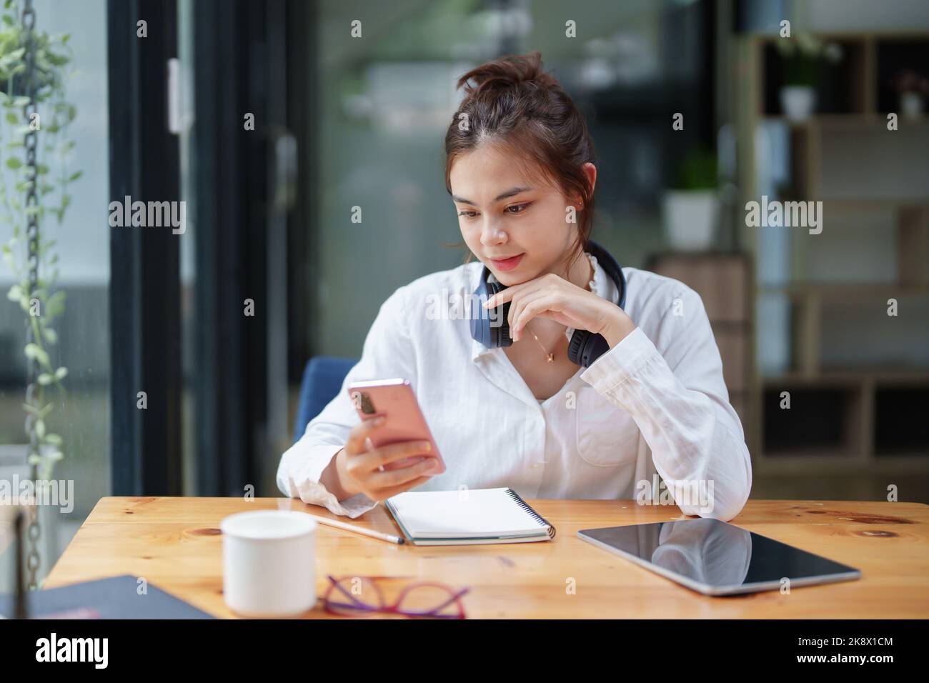 teenage girl using her phone to make video calls or call friends Stock ...
