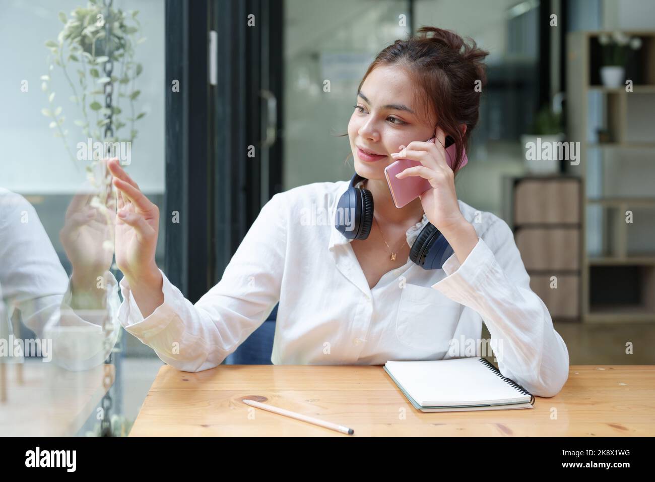 teenage girl using her phone to make video calls or call friends Stock ...
