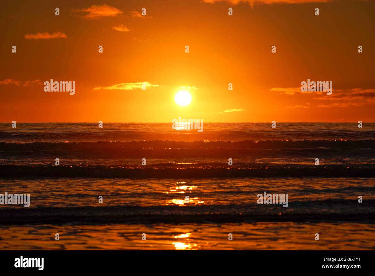 High sunset over beach Stock Photo - Alamy