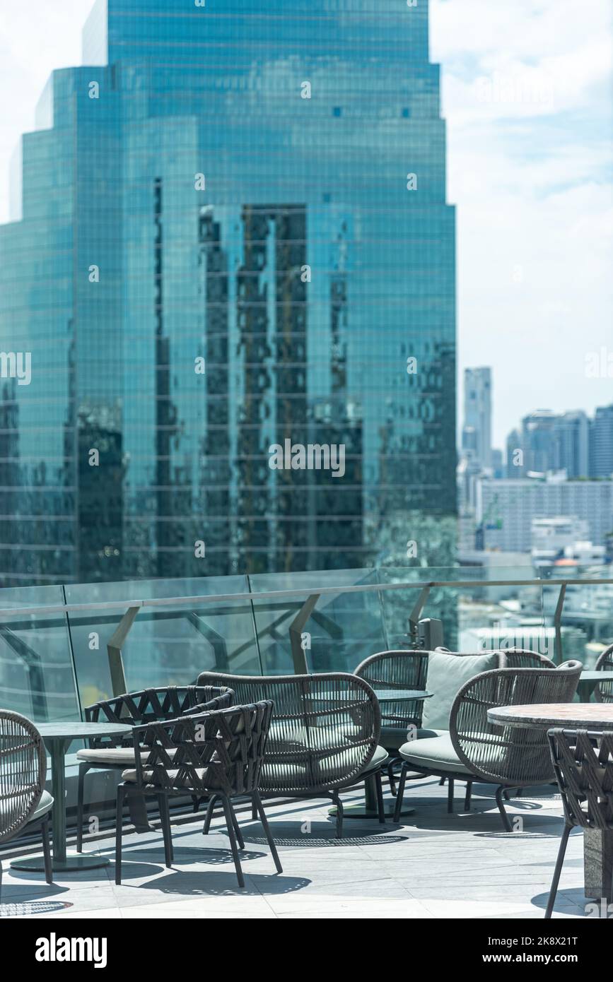 Rooftop bar terrace with skyscraper background Stock Photo - Alamy