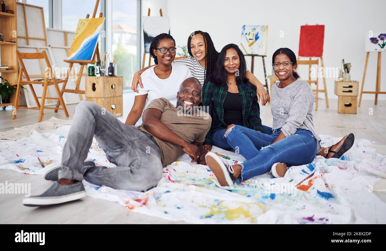 Arts and crafts keep you sane. a group of artists sitting together in a ...