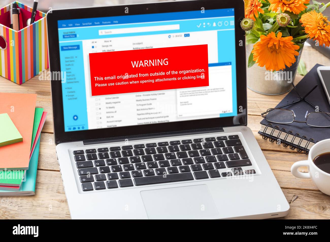 Email attachments warning message on a laptop screen. Computer Virus ...