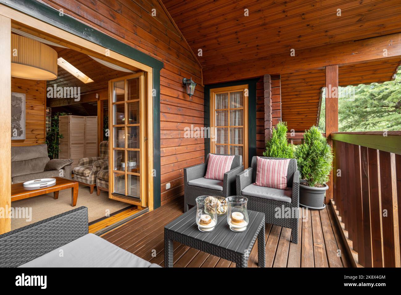 Beautiful wooden country home in the village. Cozy terrace with chairs ...