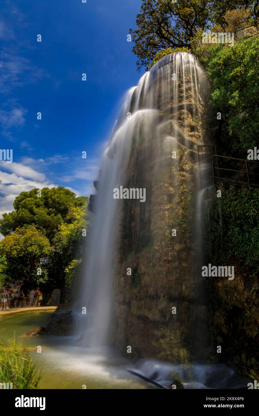 Cascading waterfall atop Castle Hill or Colline du Chateau at the park ...