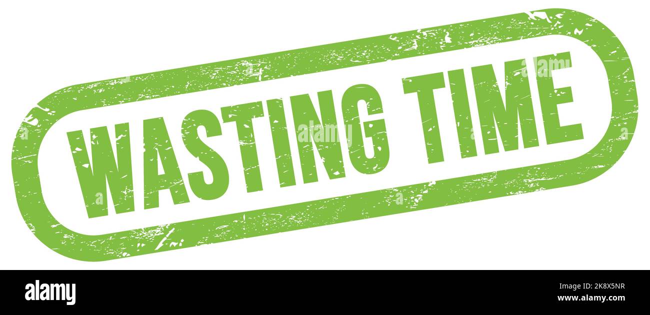 WASTING TIME, text on green rectangle stamp sign Stock Photo - Alamy