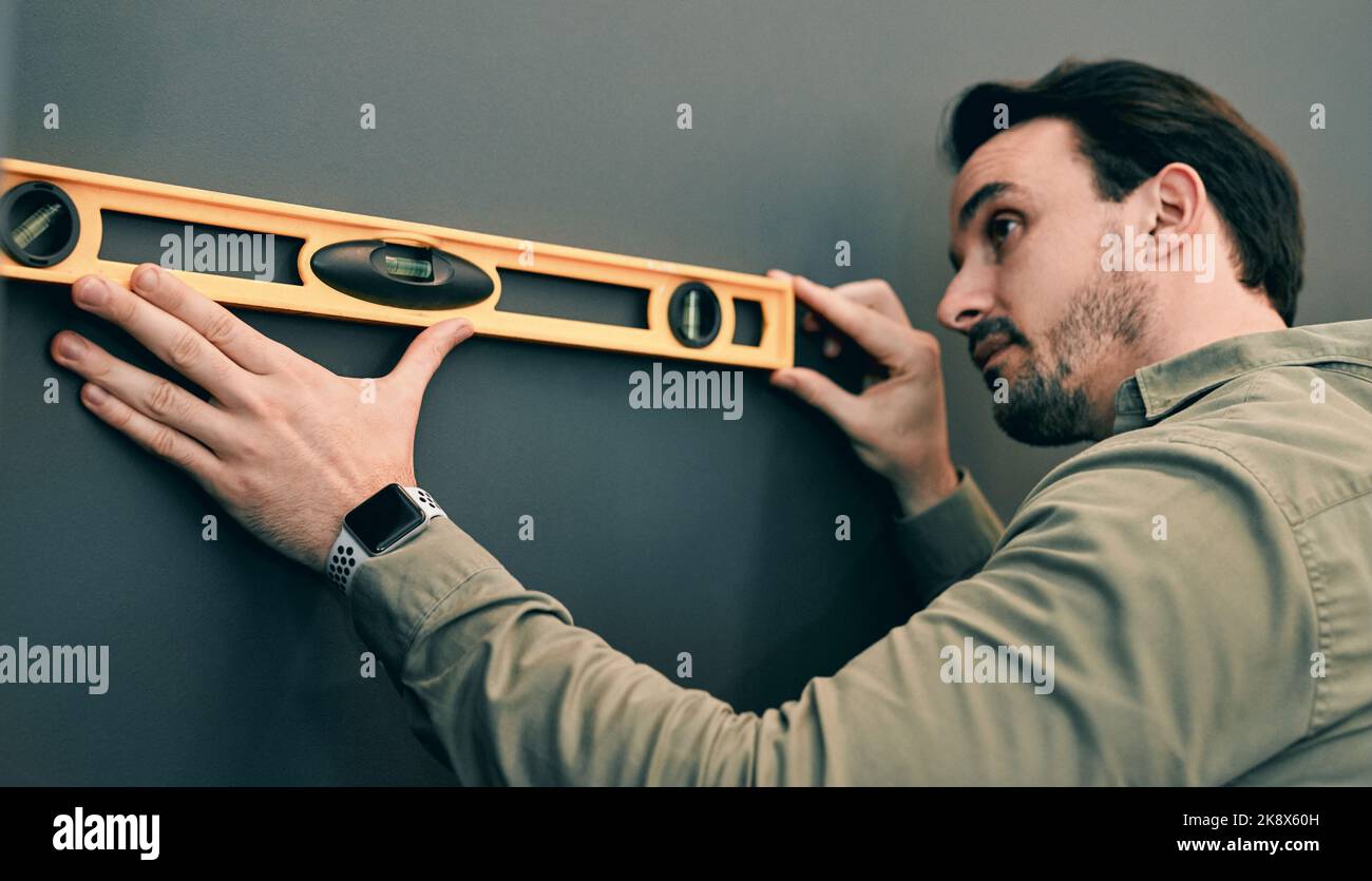 Every detail has to be perfect. a young architect holding a spirit ...