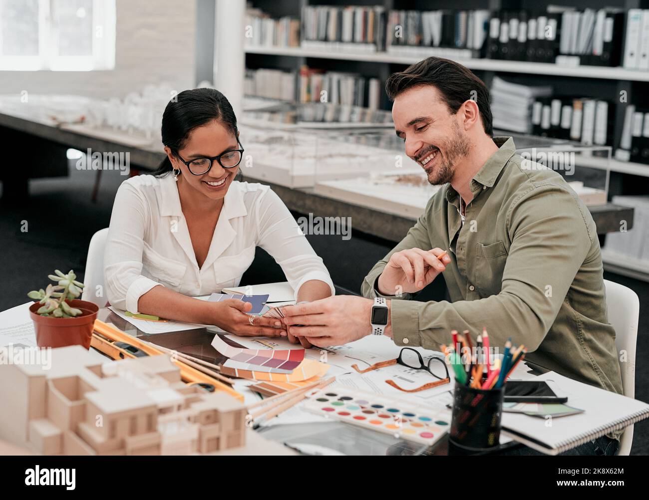 Im really proud of our work. two aspiring young architects smiling ...