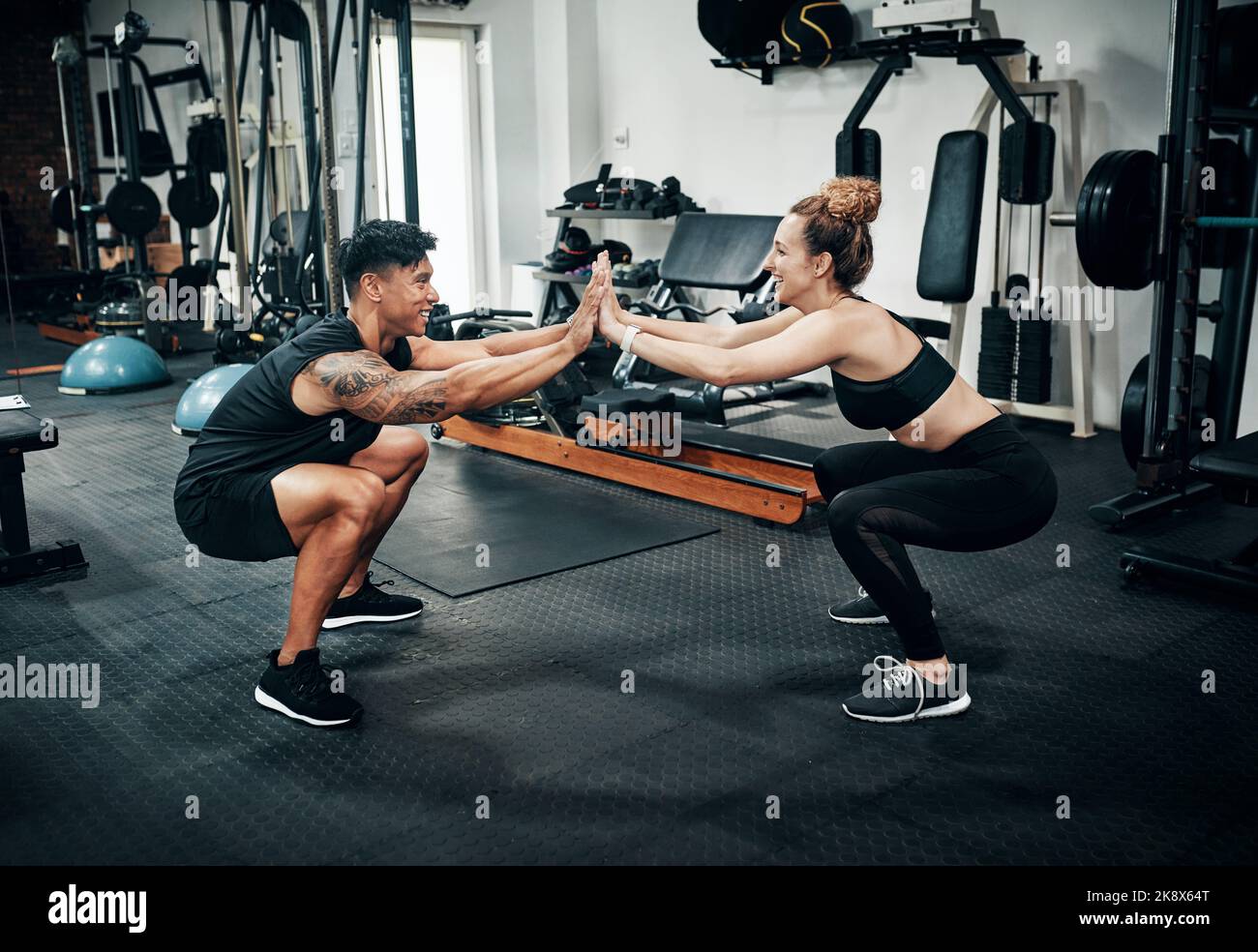 We raise our pain threshold when working out together. two sporty young ...