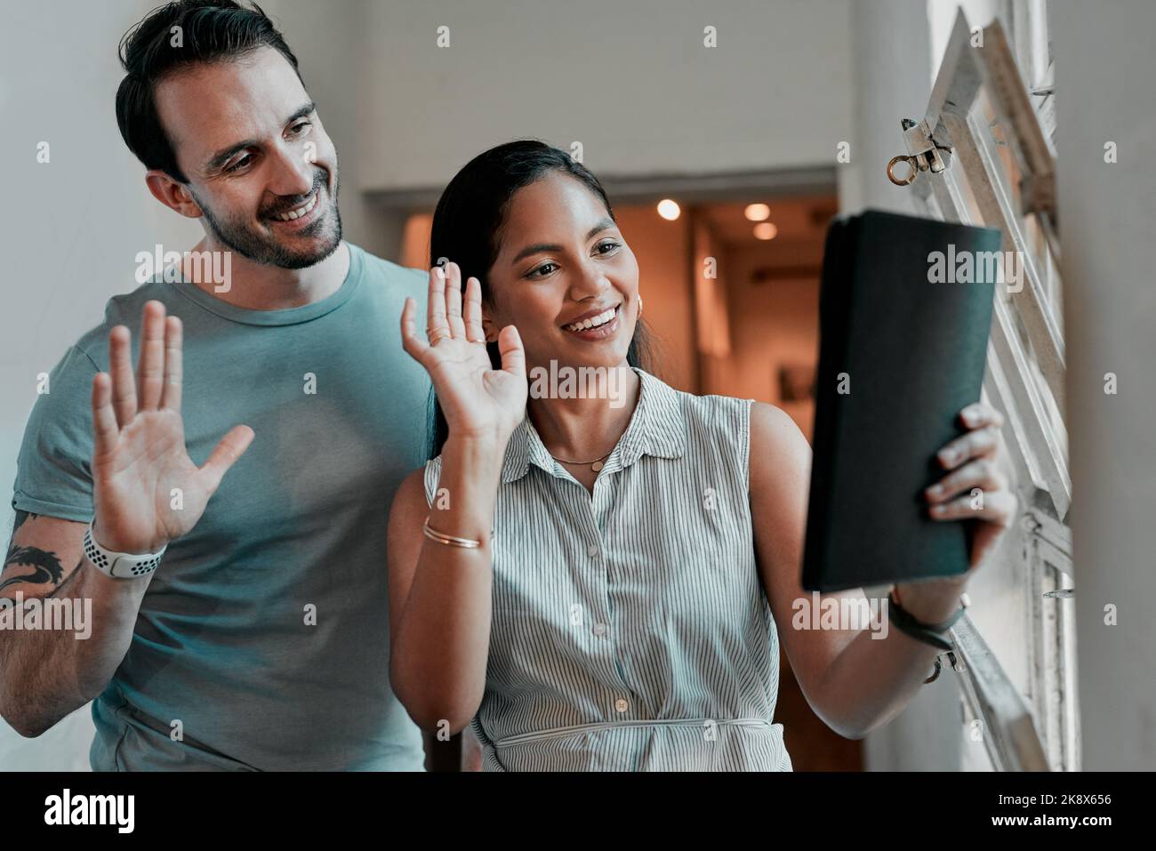 Were glad that youre happy with our work. two young designers using a ...