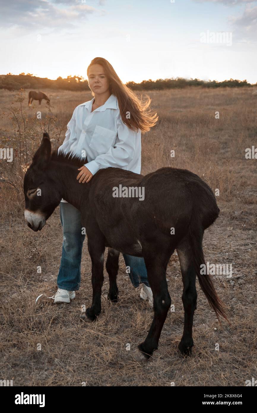 Riding a donkey in the sunset hi-res stock photography and images - Alamy