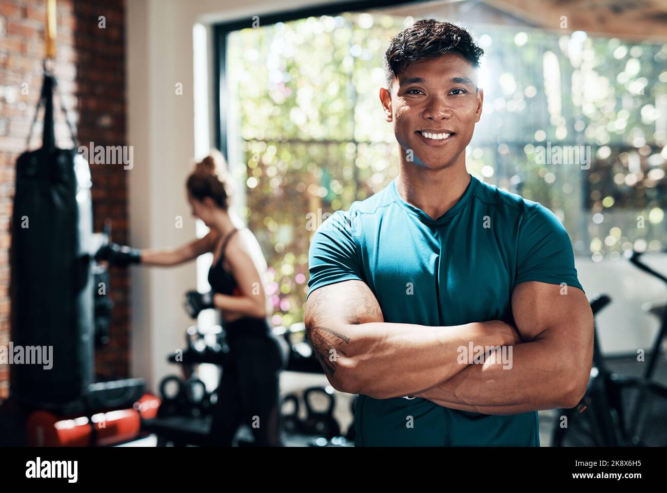 The gym is my second home. a handsome young sportsman standing with his ...
