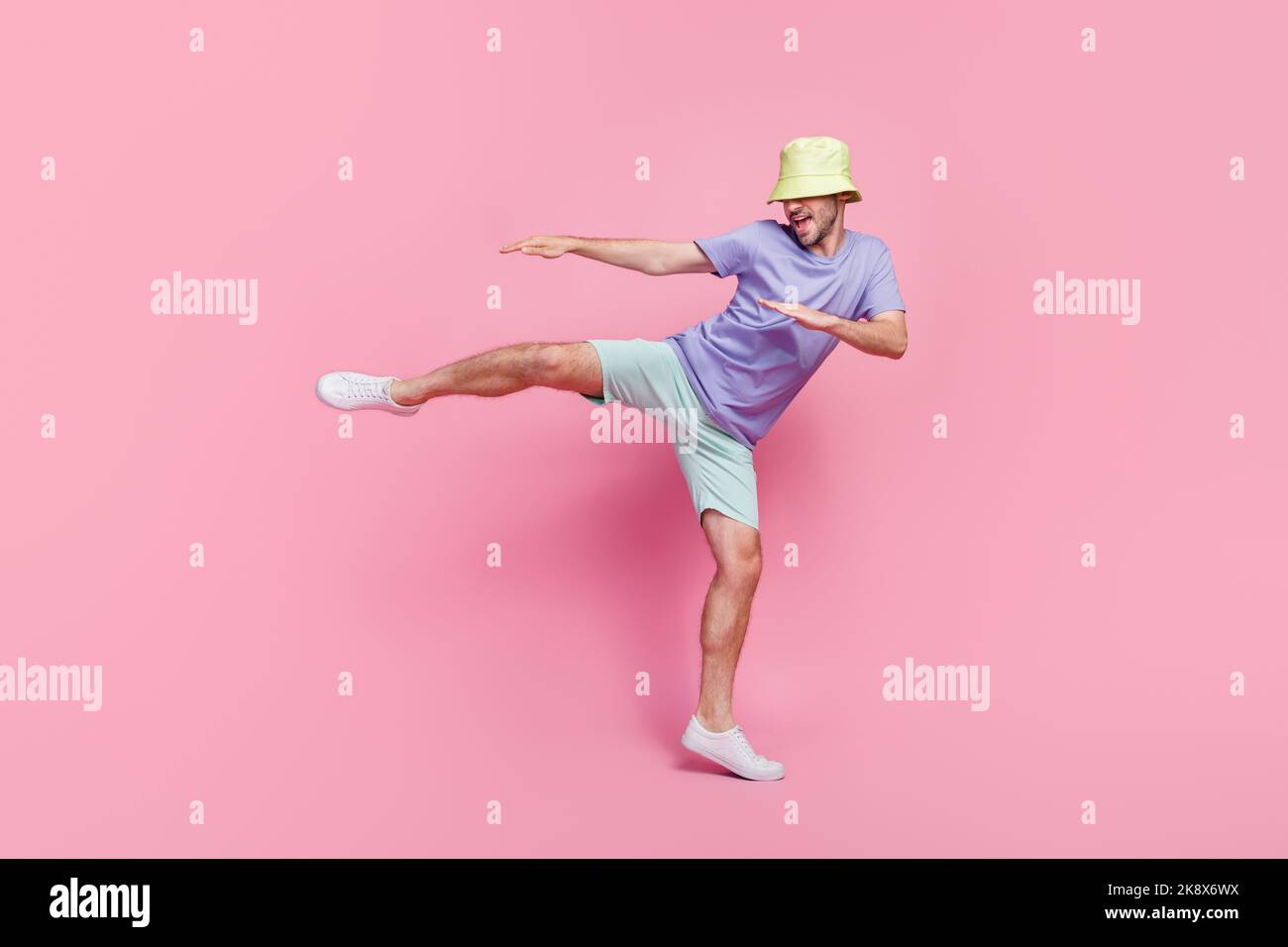 Full size photo of crazy dude guy leg foot kick box look empty space ...