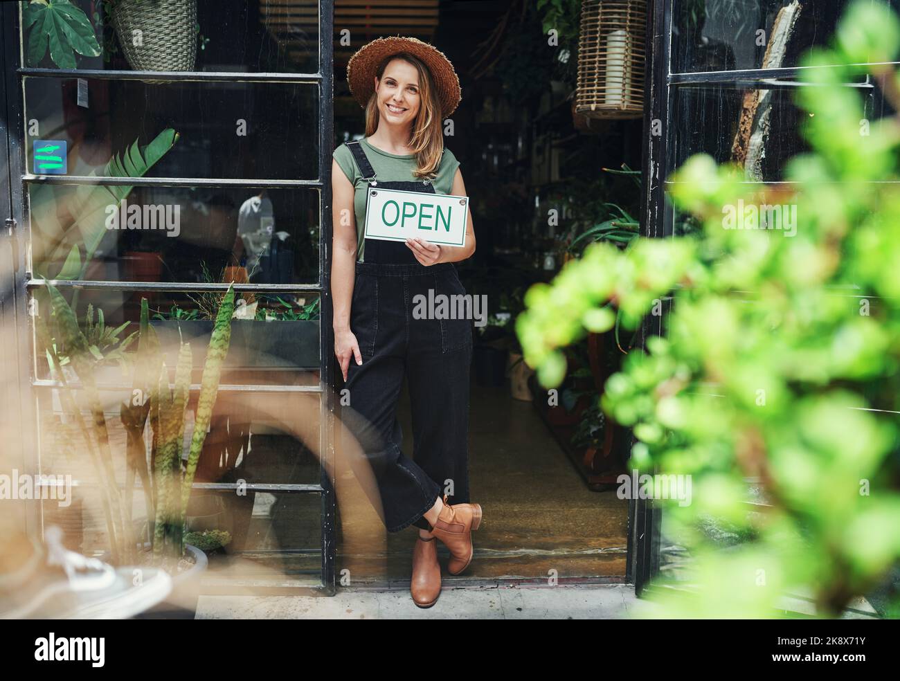 Welcome to my flower shop. Full length portrait of an attractive young ...