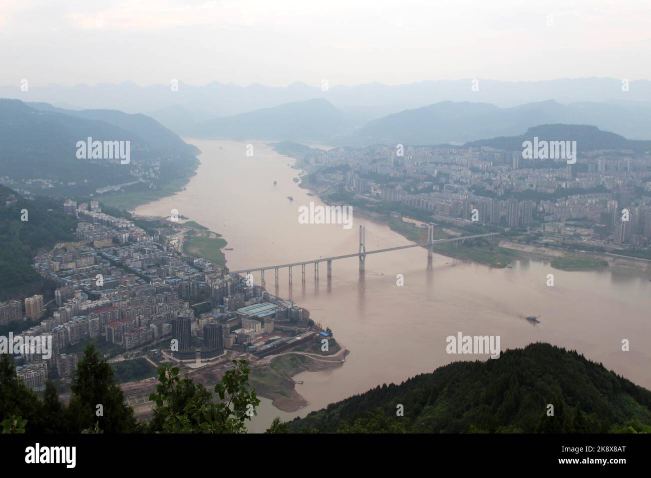 Cargo ships shuttle back and forth in the Yangtze river channel, also ...