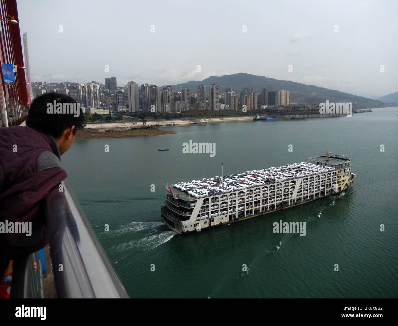 Cargo ships shuttle back and forth in the Yangtze river channel, also ...