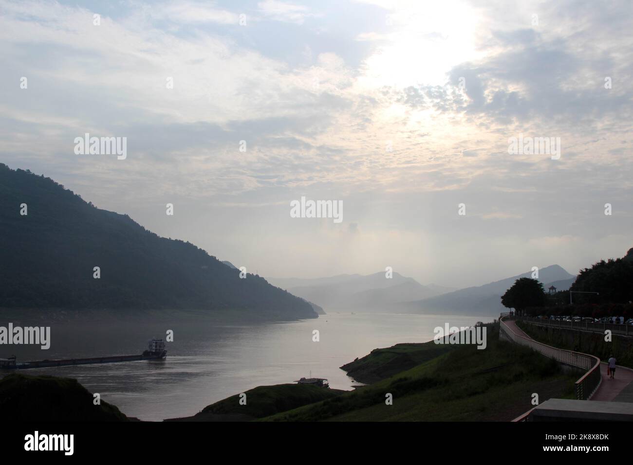 Cargo ships shuttle back and forth in the Yangtze river channel, also ...