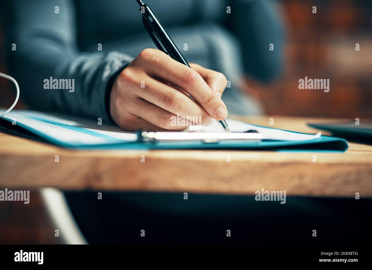 I make notes of everything. an unrecognizable woman making notes at her ...