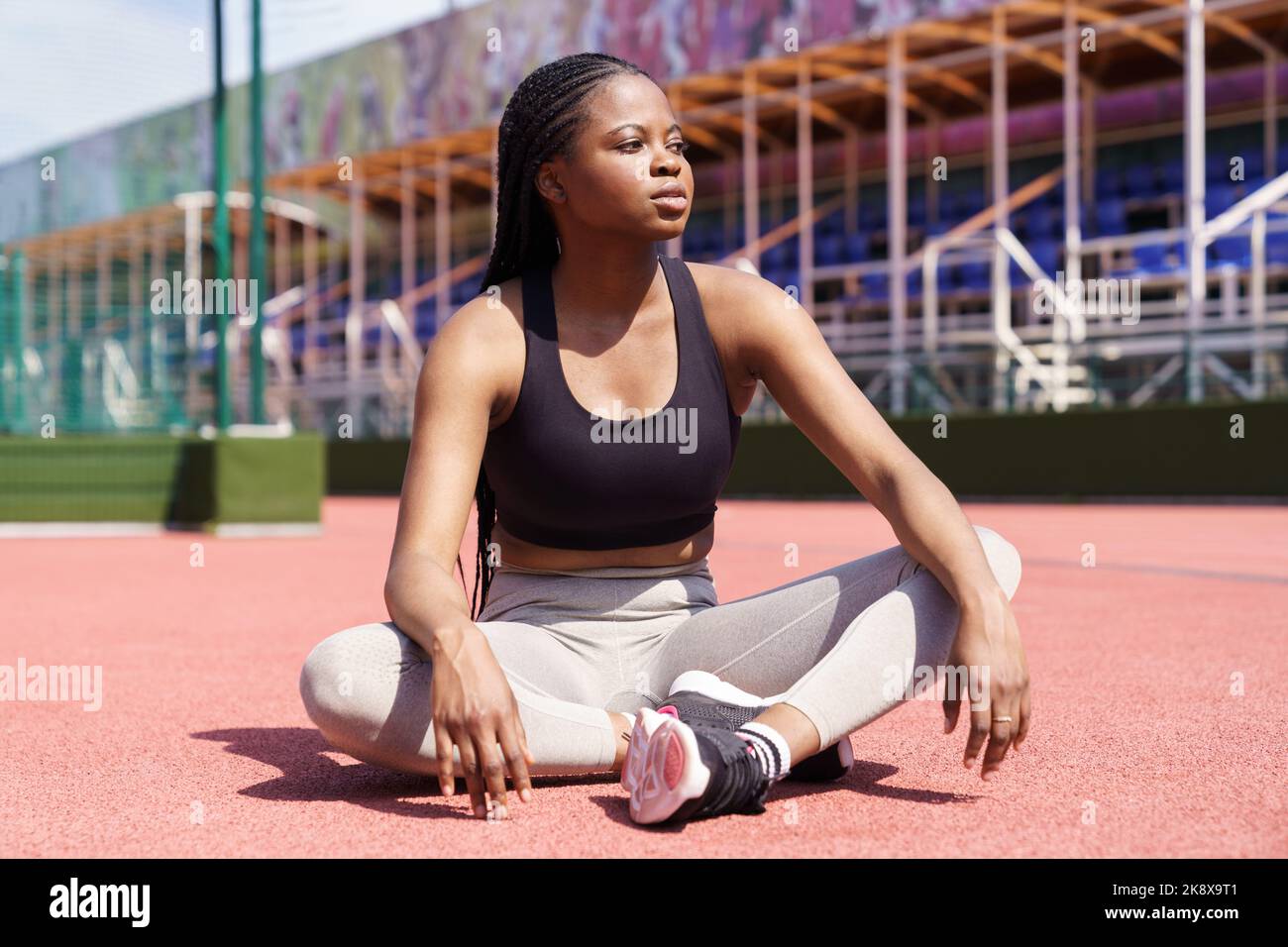 Professional African American woman athlete tunes in before competition ...