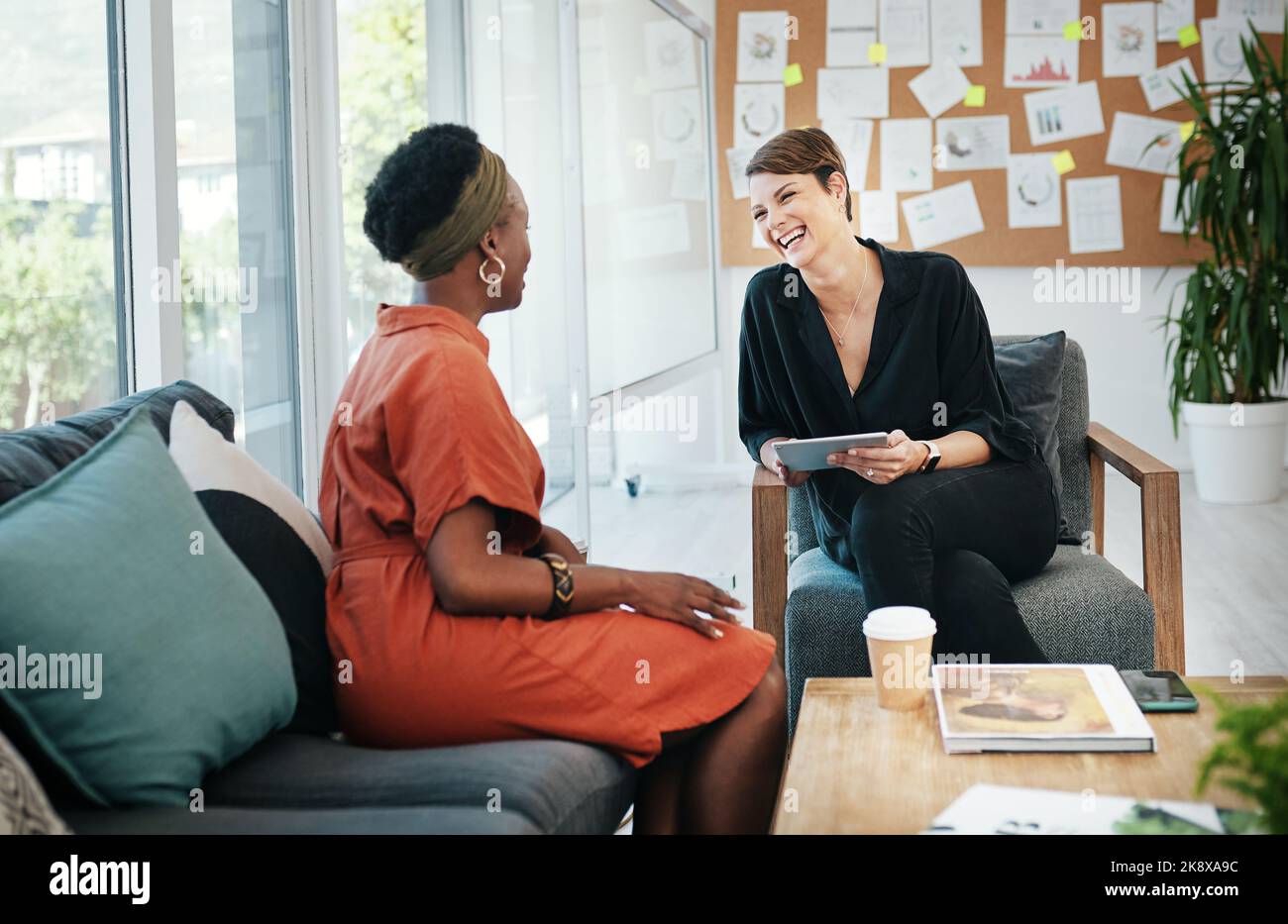 Sharing a laugh before getting down to business. two attractive young ...