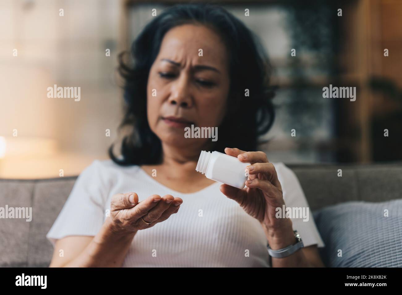 Elderly Asian Woman taking pill at home. Age, Medicine, Healthcare and ...