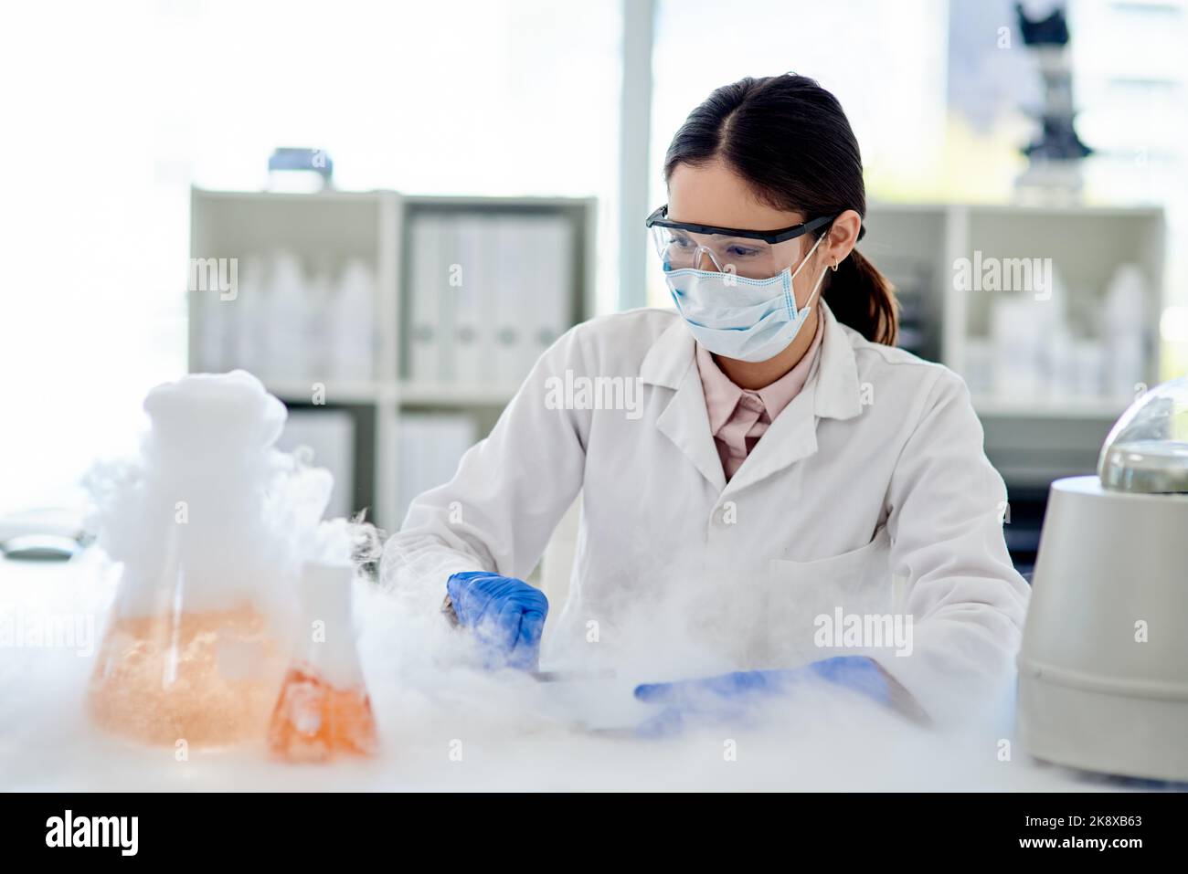 Look at that chemical reaction. a young scientist doing an experiment ...