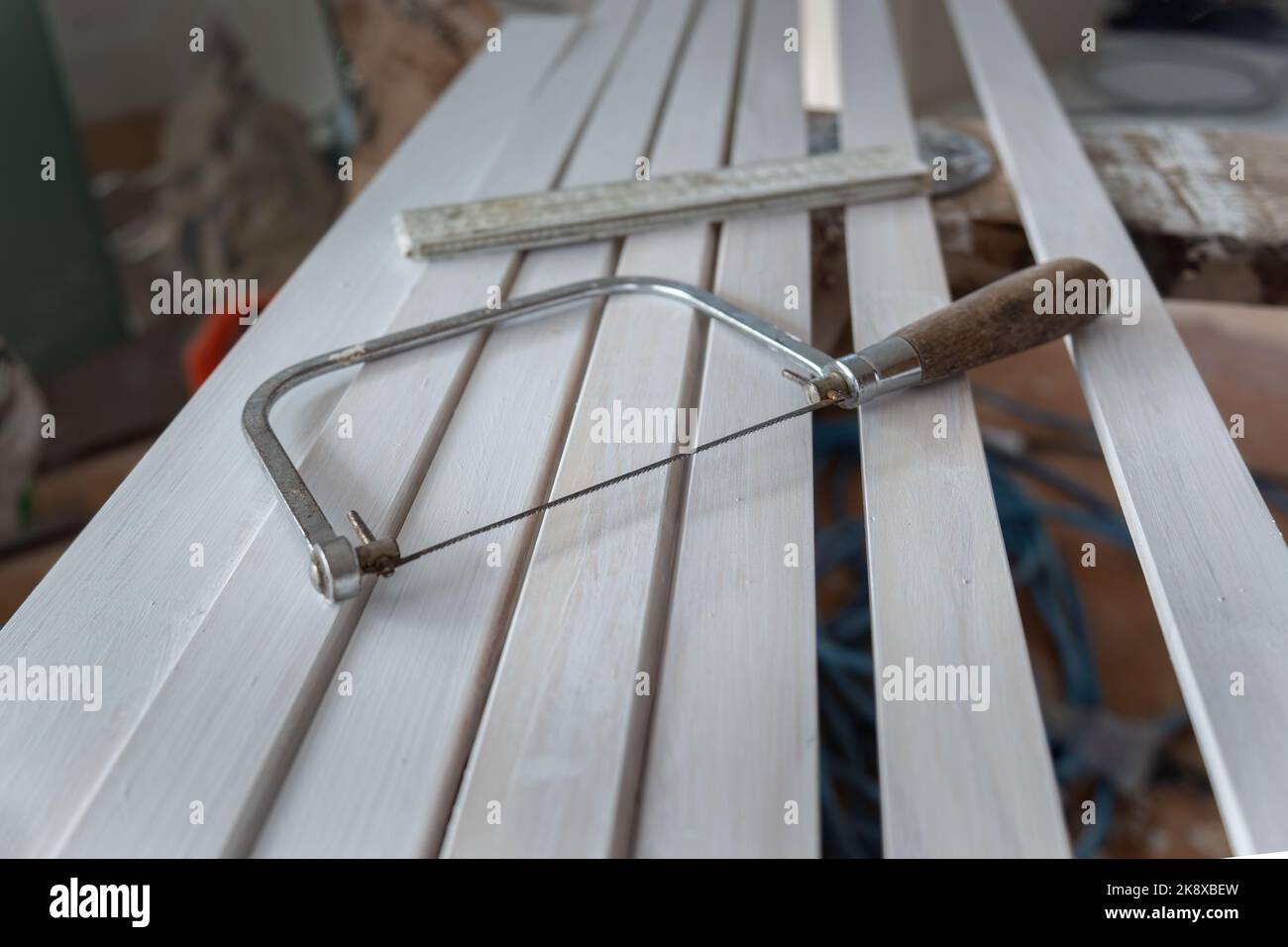 Hand saw and ruler on wood planks. Home renovation project Stock Photo ...