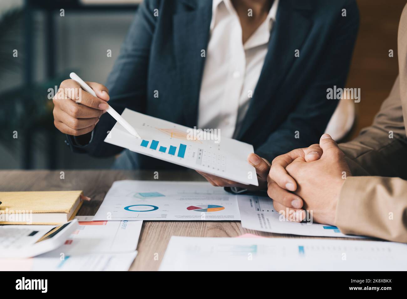 Group of business asian people analysis financial graph on desk at ...