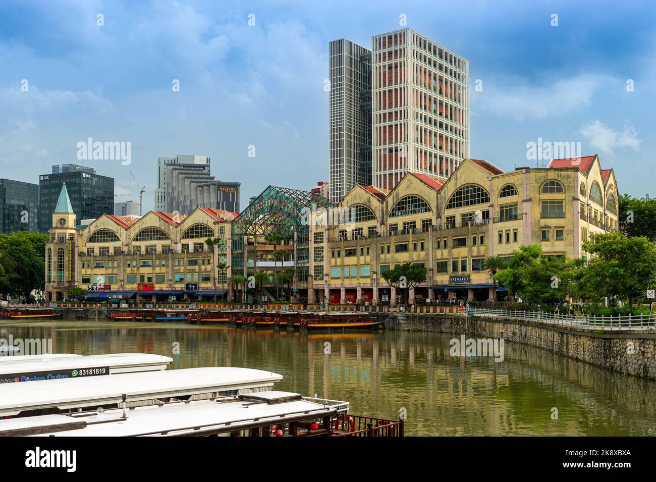 Tourist boats awaiting a river cruise, at Riverside Point, Singapore ...