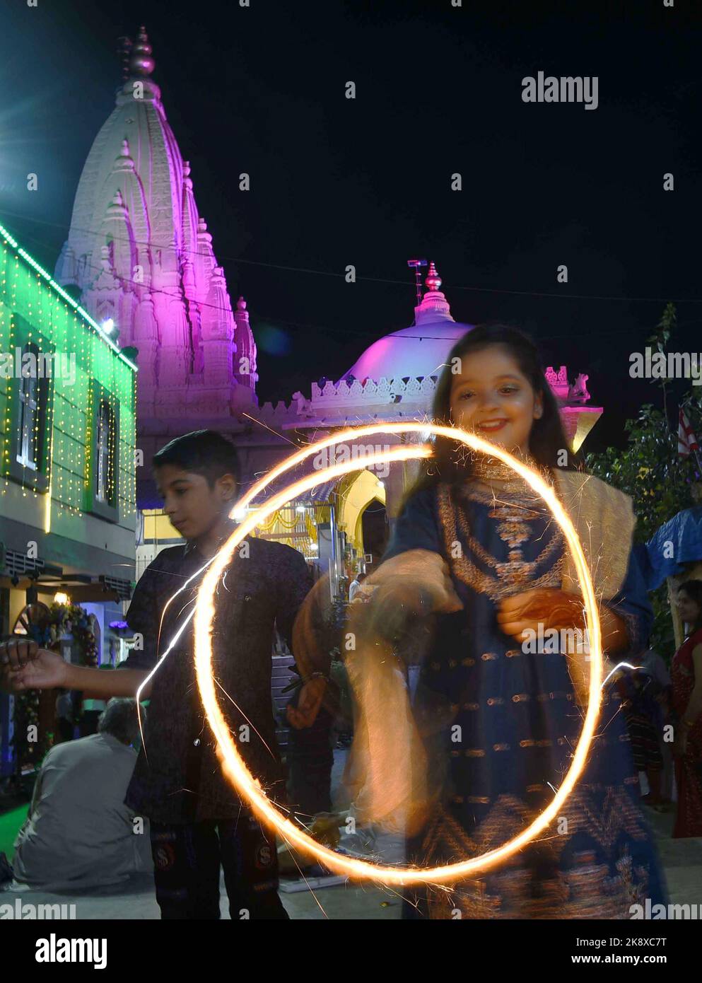 Karachi, Pakistani port city of Karachi. 24th Oct, 2022. A girl plays ...