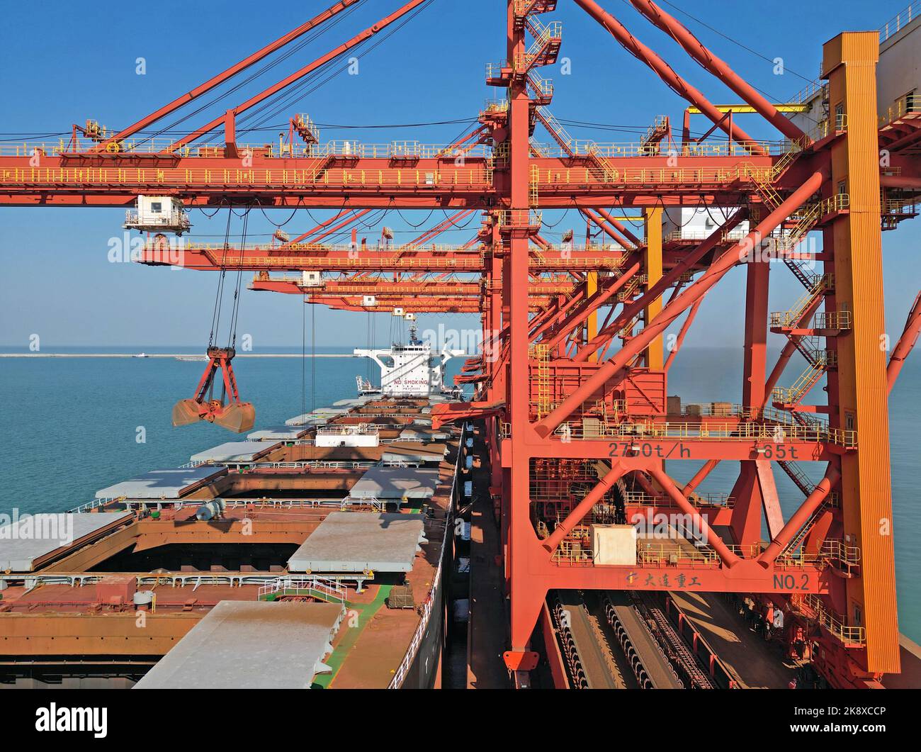 The ship unloader was unloading iron ores at the 400000 ton ore ...