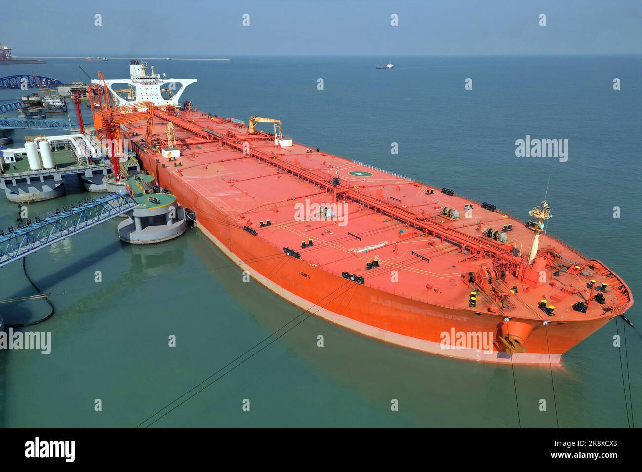 An oil tanker discharged oil through a pipeline at the 300000 ton crude ...