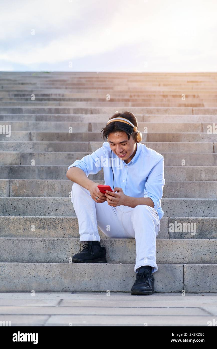 Carefree asian man listening music hi-res stock photography and images ...
