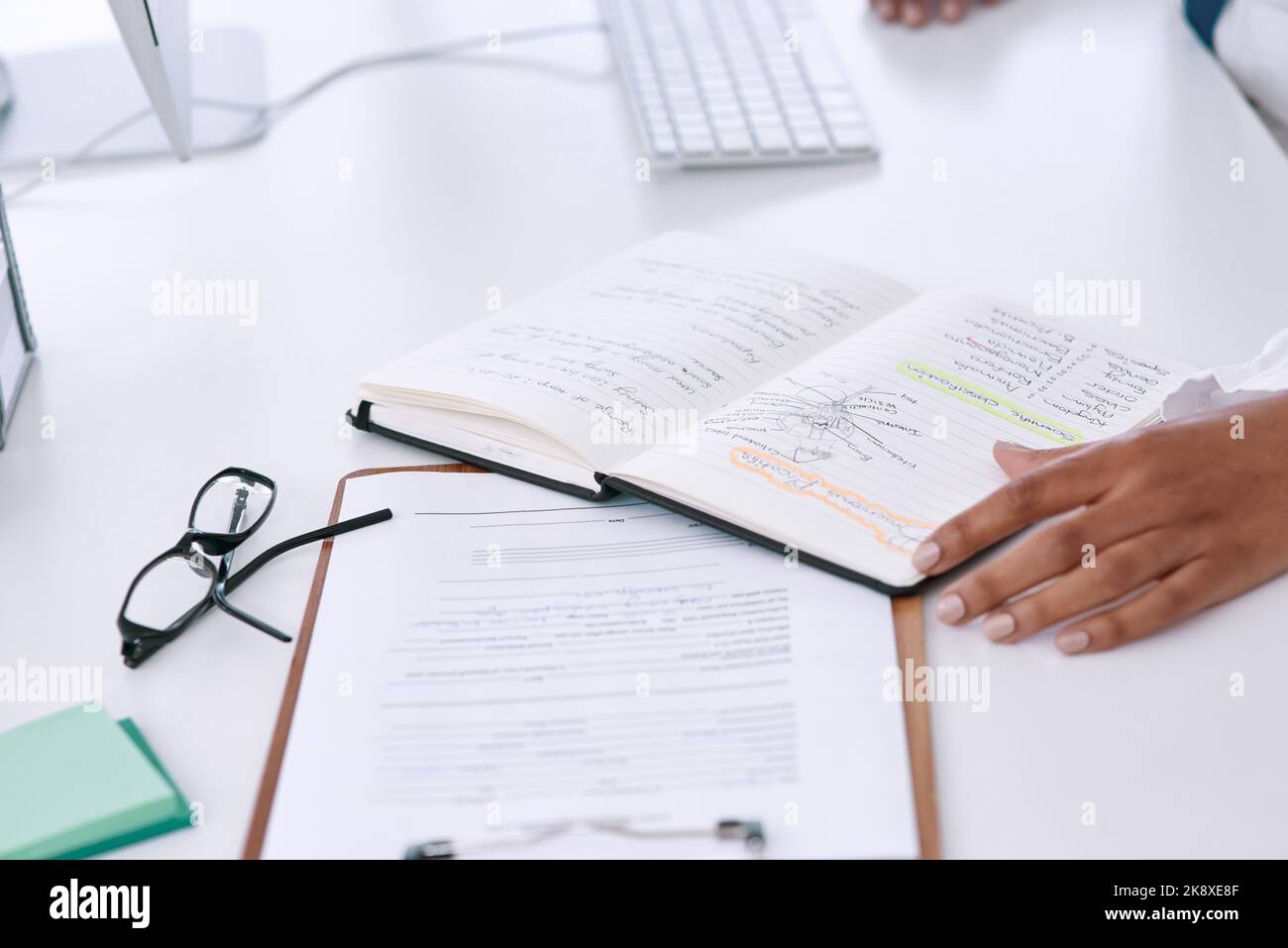 Documenting her findings in her diary. High angle shot of an ...