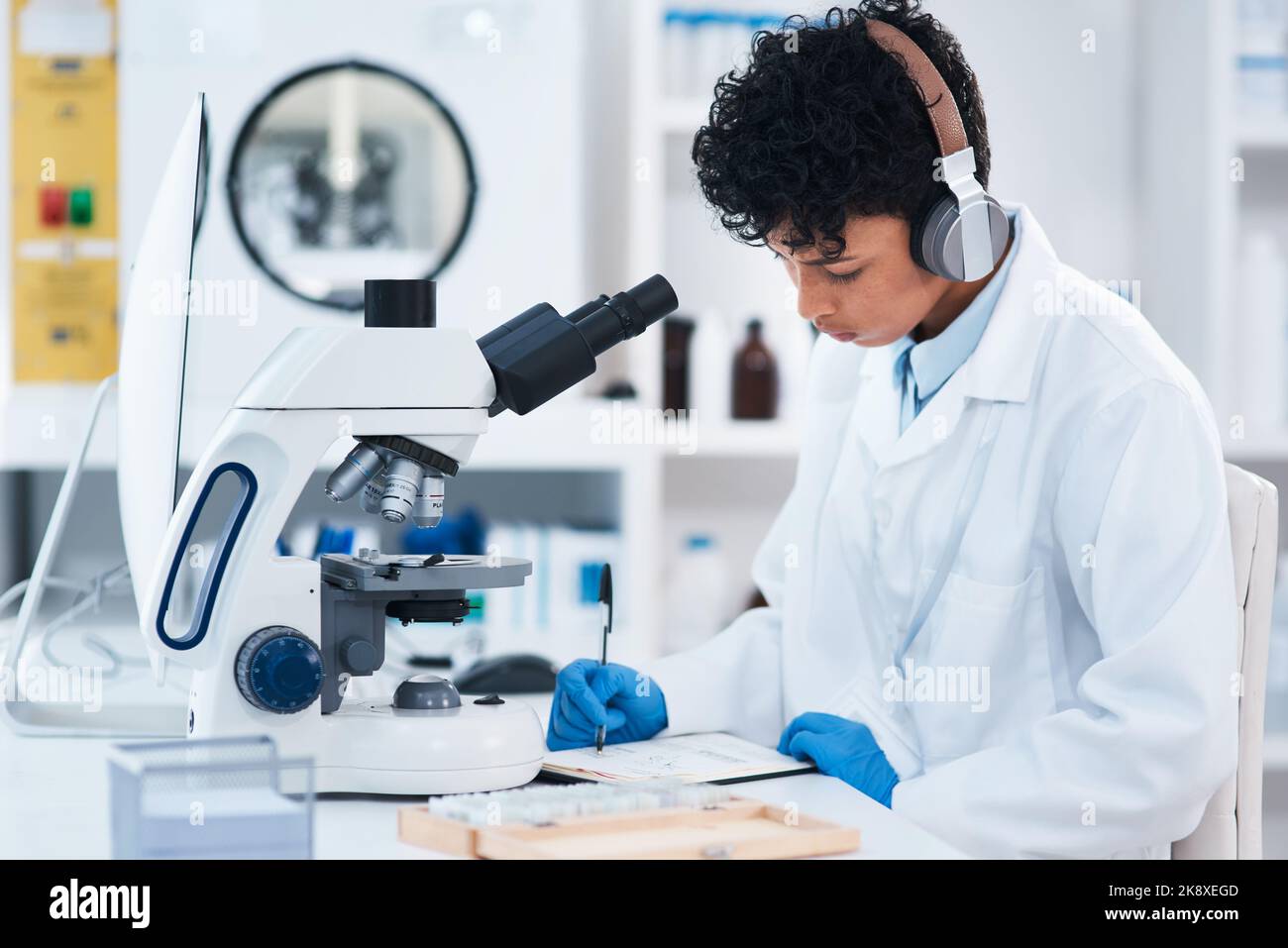 Making her contribution towards the sciences. a young scientist wearing ...