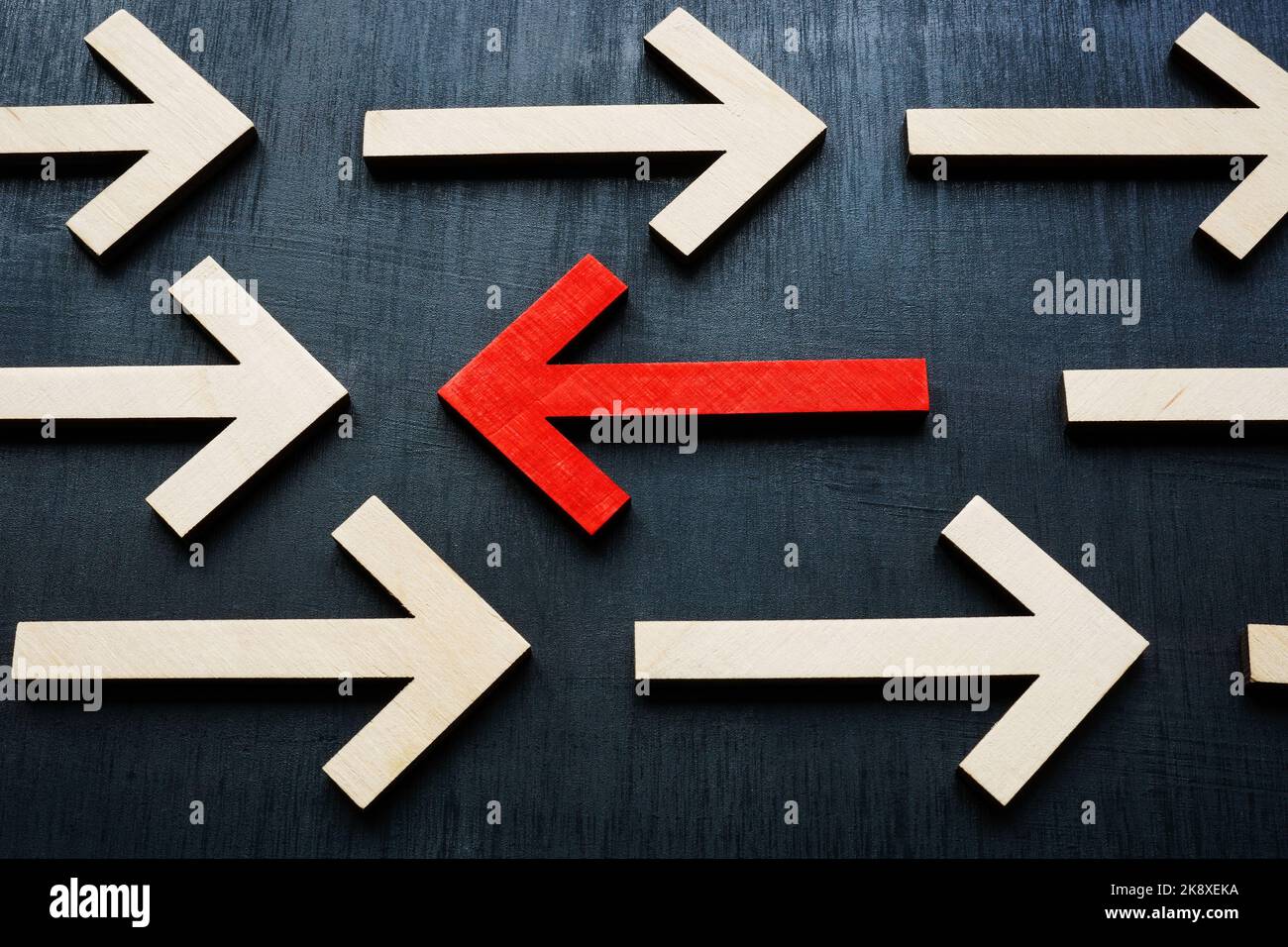 Arrows in one direction and red in the opposite. On contrary, be ...